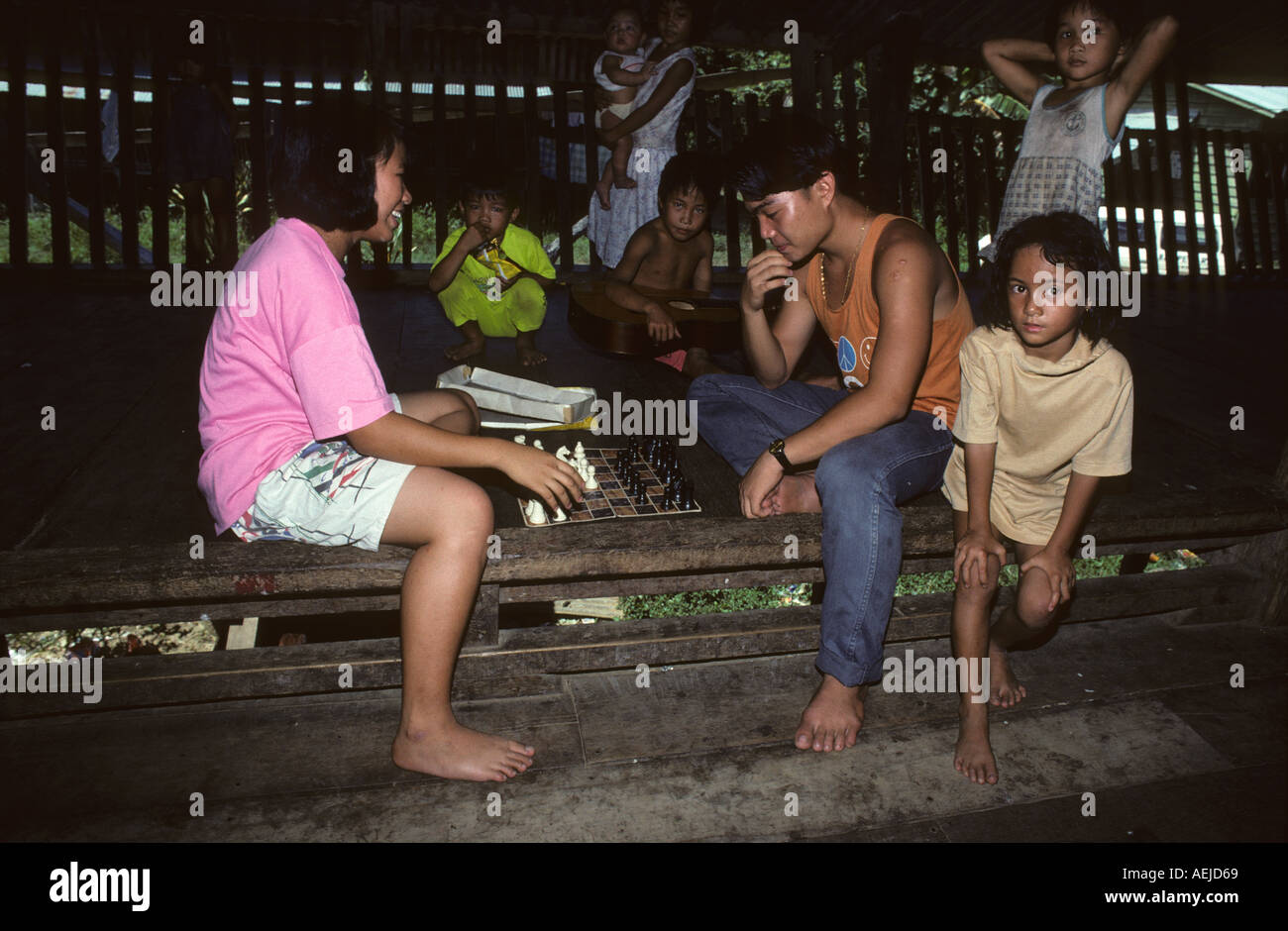 Children playing chess in the Mompilis Longhouse Rungus Tribe Kadazan ...