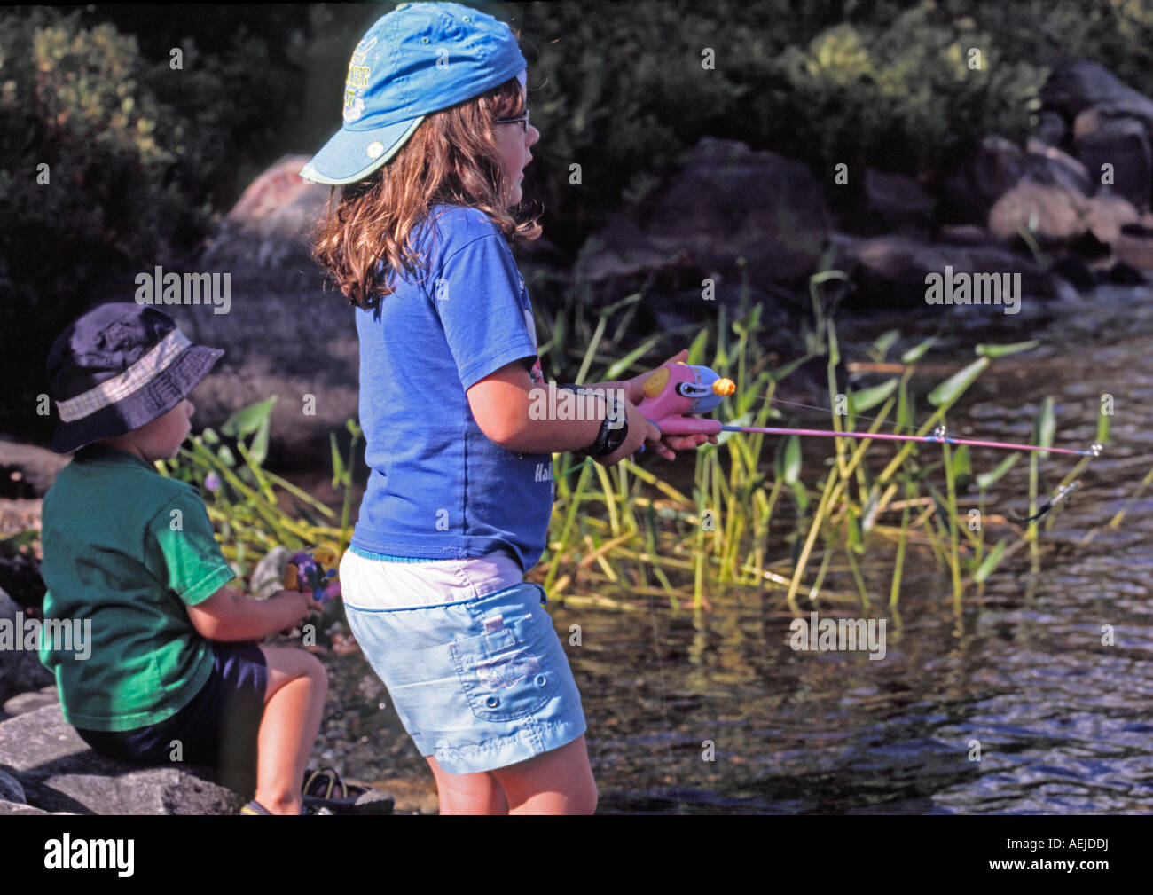 kids fishing in a pond Stock Photo - Alamy