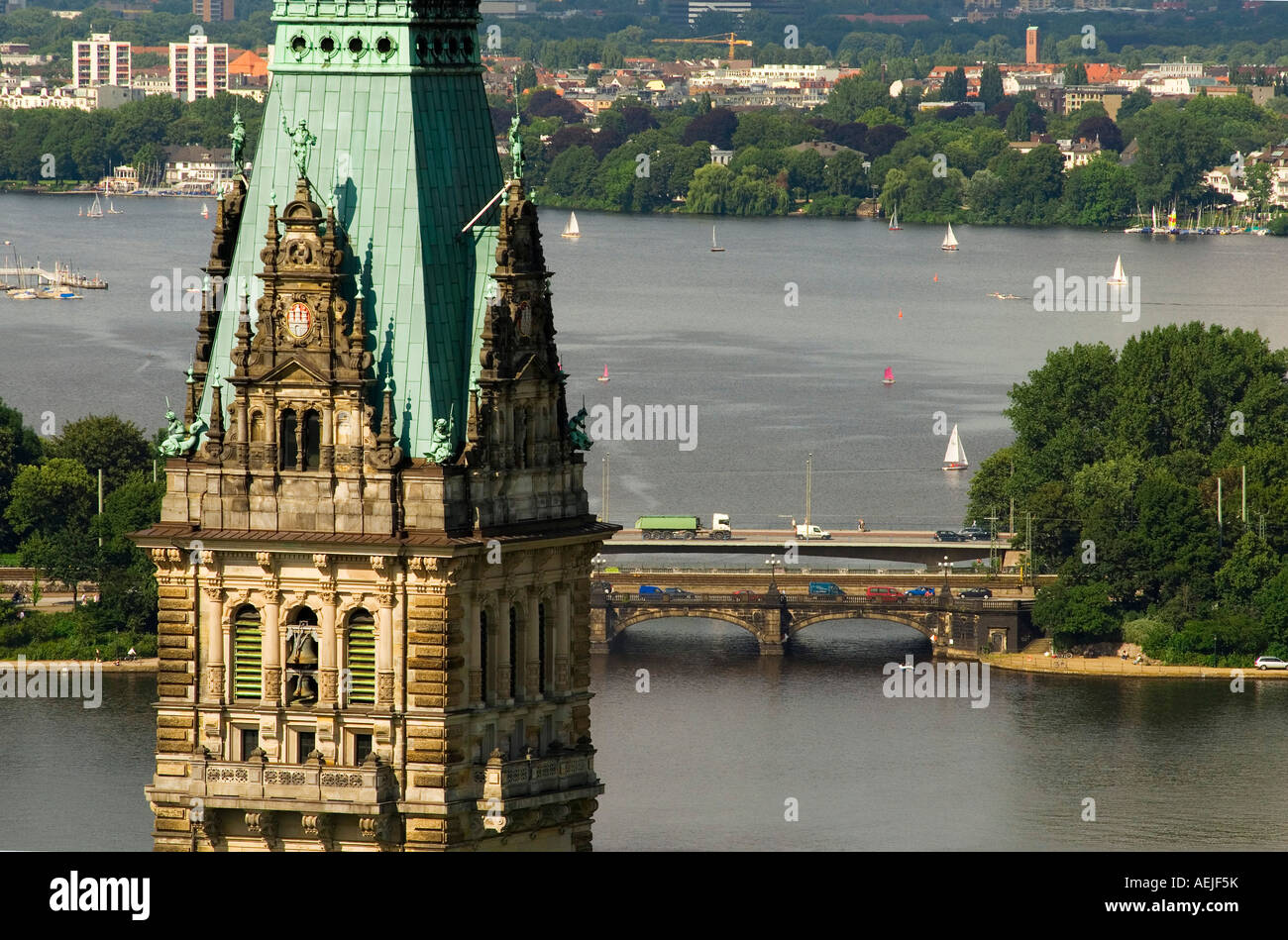 The tower of Hamburg City Hall in front of lake Alster, Hamburg ...
