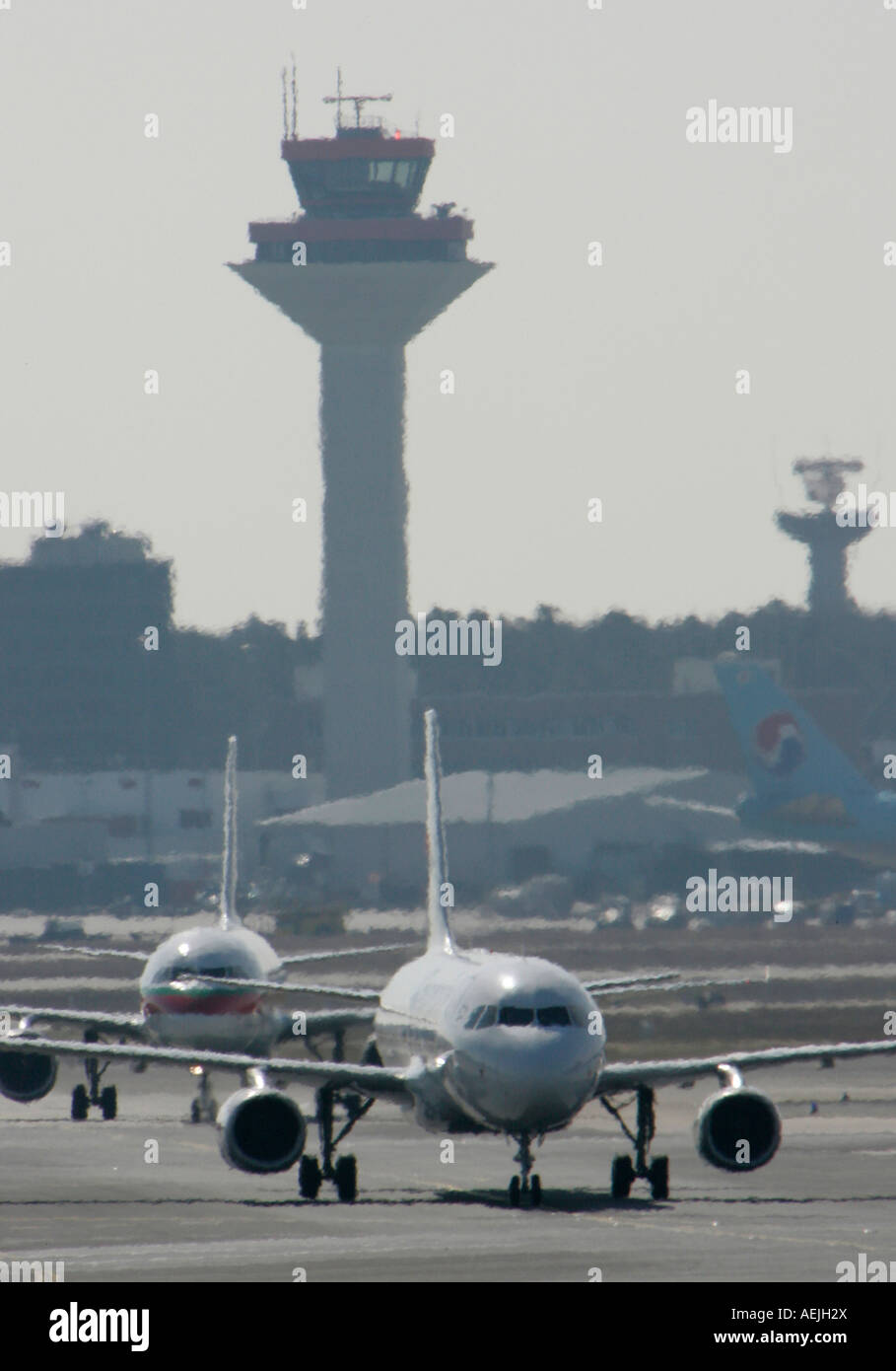 Manoeuvering area with airplane and tower at torrid heat, Frankfurt ...