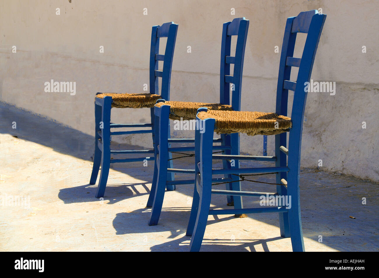 Typically greek: blue chairs, Nisyros, Dodecanese, Greece Stock Photo ...