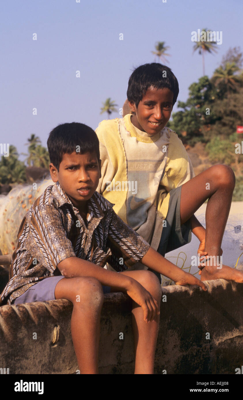 Local boys on boat Gokarna Beach India Stock Photo - Alamy