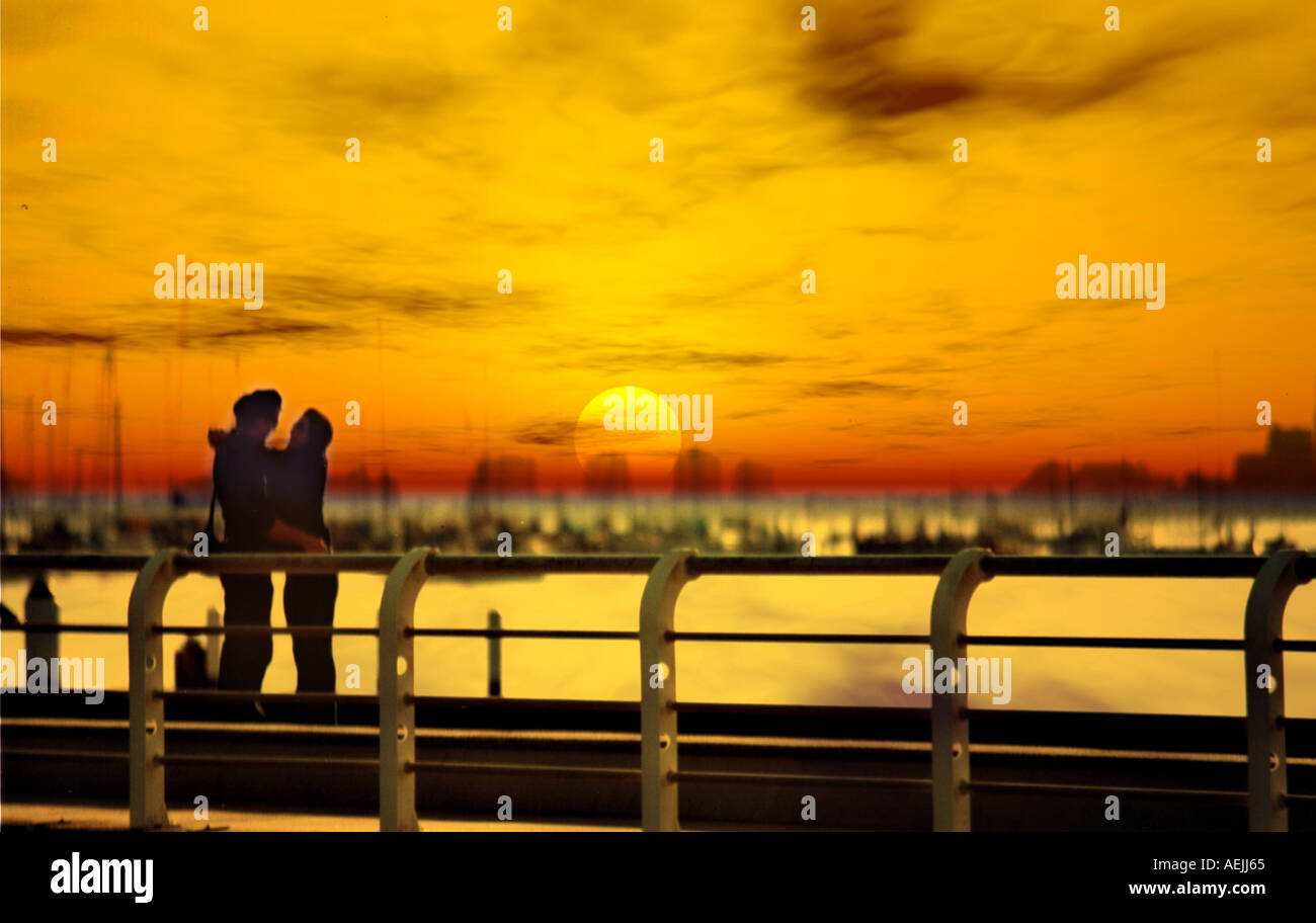 Loving couple hugs sunset hi-res stock photography and images - Alamy
