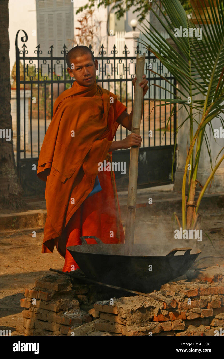 Monk at work cooking, Luang Prabang, Laos Stock Photo - Alamy