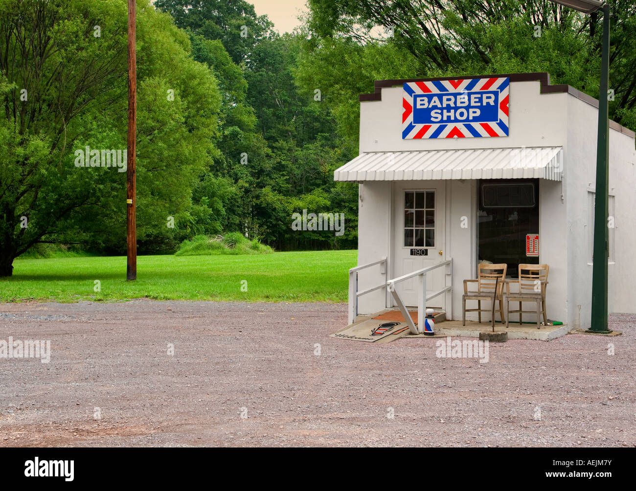 Small barber shop with bold sign Stock Photo - Alamy