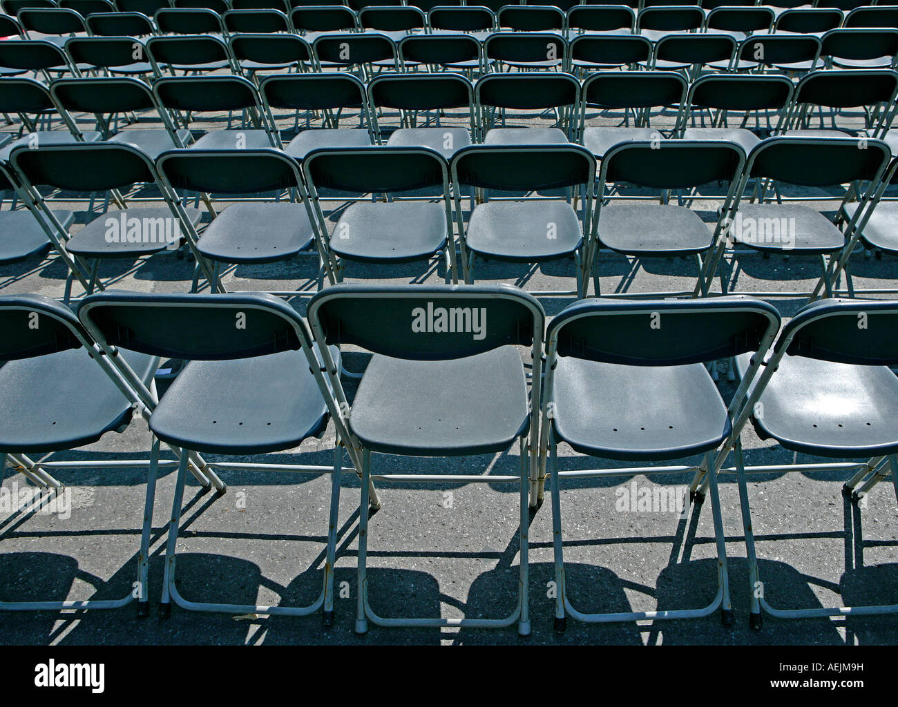 Rows with black chairs, from behind Stock Photo - Alamy