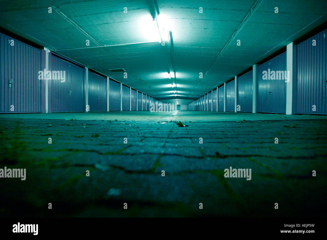 Empty garage with blue shimmer Stock Photo - Alamy