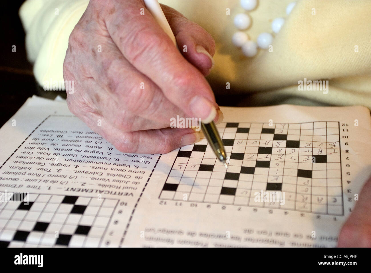 Doing a cross word puzzle hi-res stock photography and images - Alamy