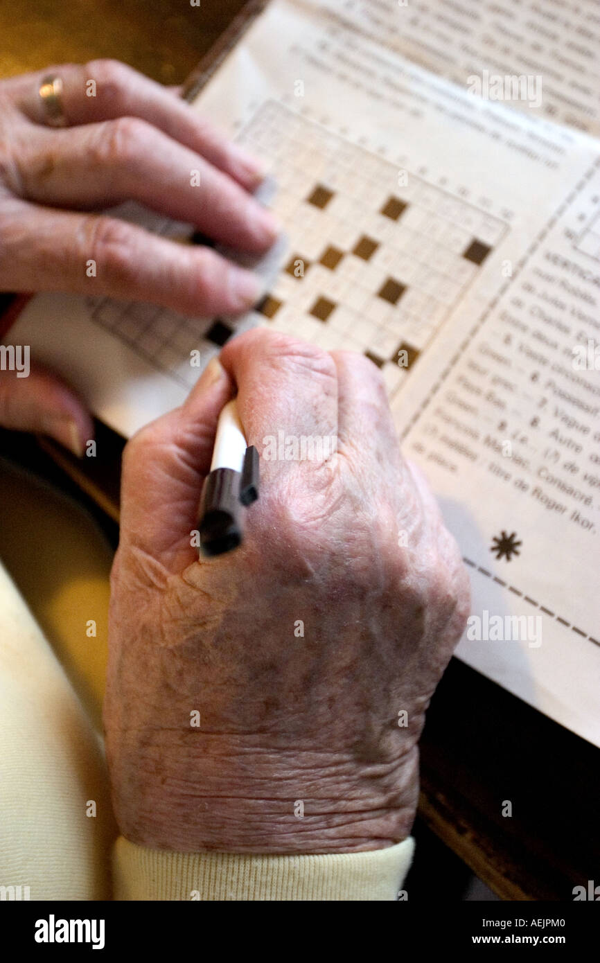 Doing a cross word puzzle hi-res stock photography and images - Alamy