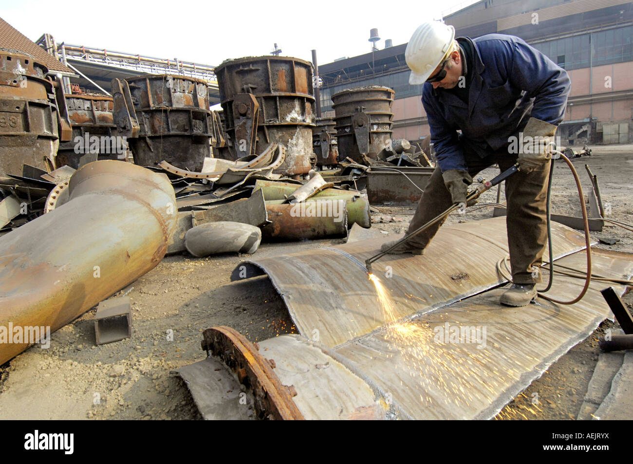 Stripping down the old blast furnace. cutting with a welding torch ...