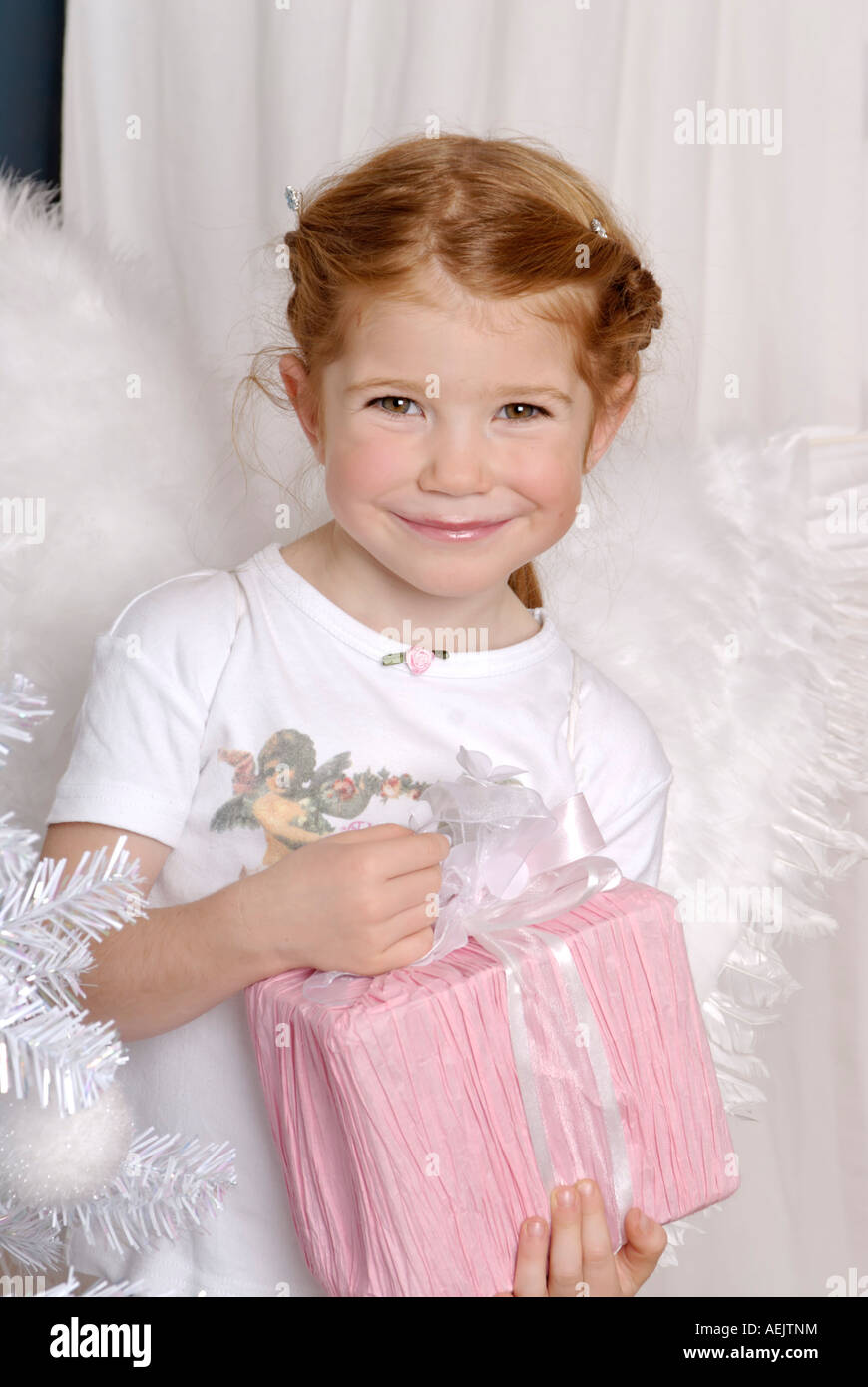 Angel and present hi-res stock photography and images - Alamy