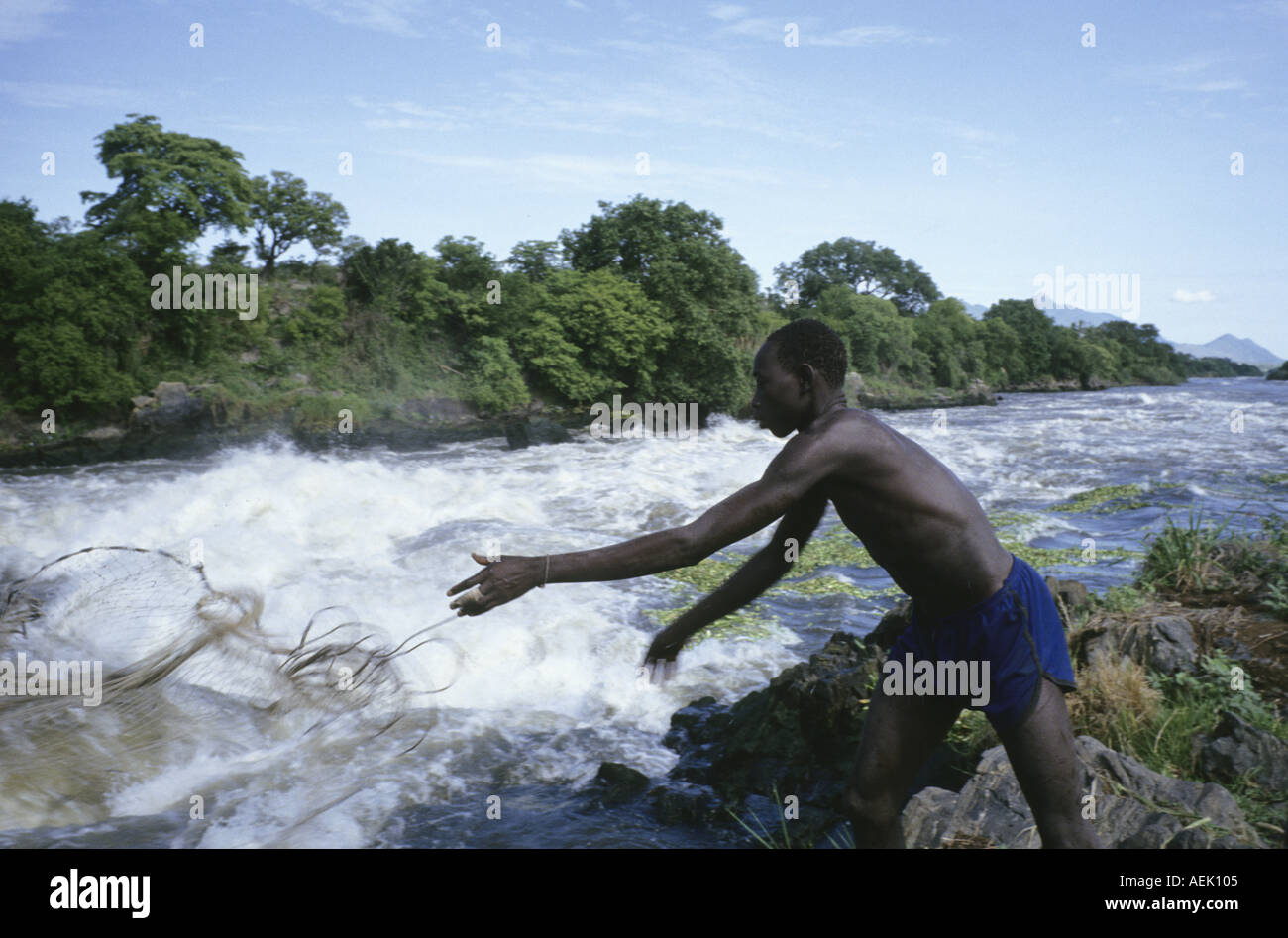 A fisherman casts his net into river Nile near Nimule Uganda Stock ...