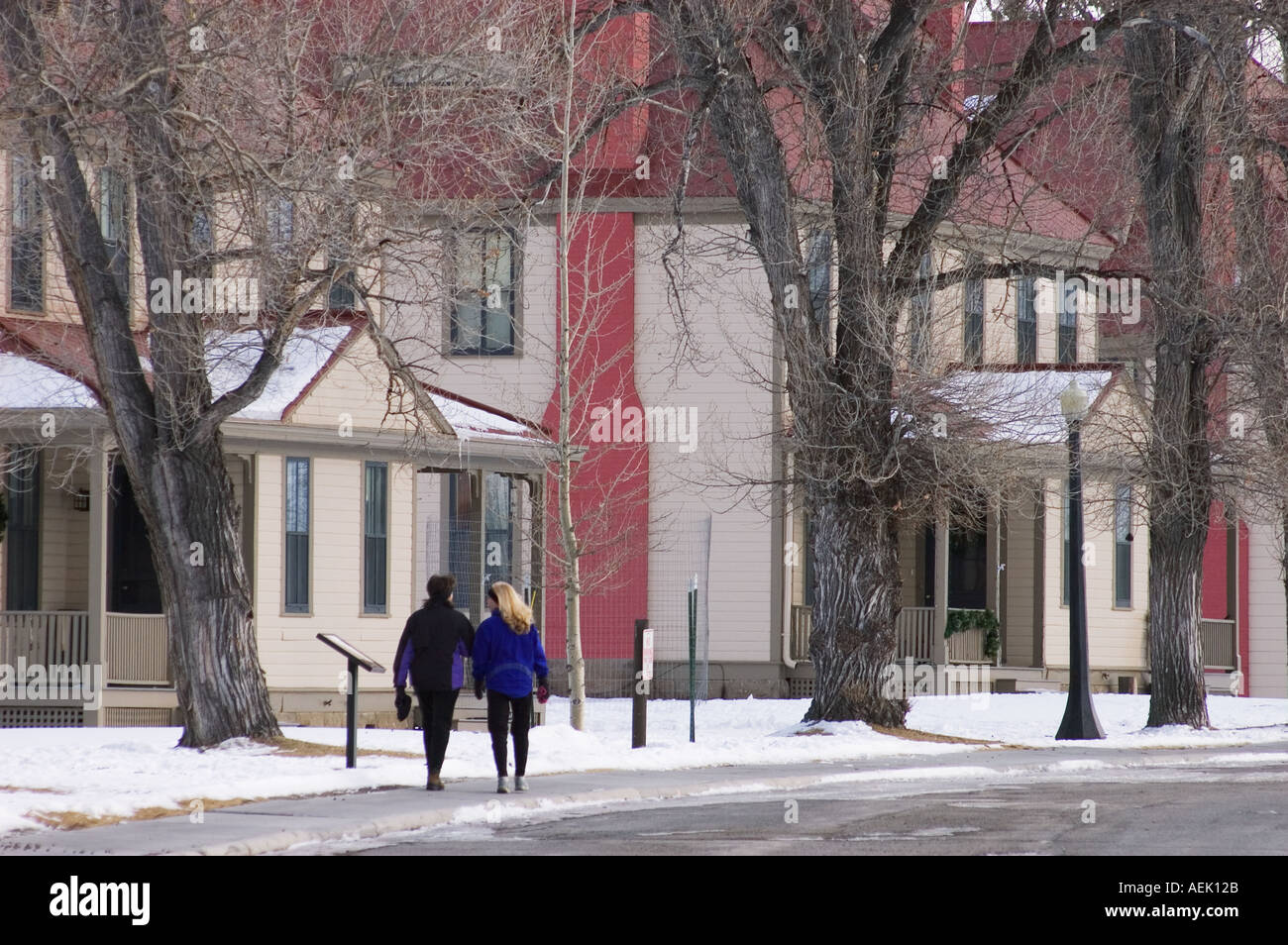 Fort Yellowstone Officers Quarters with women walking on sidewalk ...