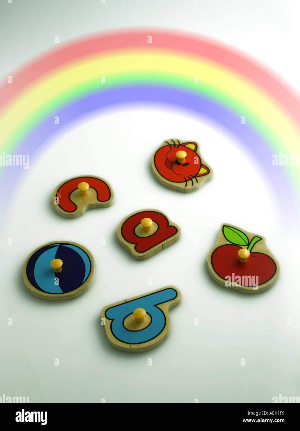 Letters of the alphabet with symbols with rainbow overhead Stock Photo ...