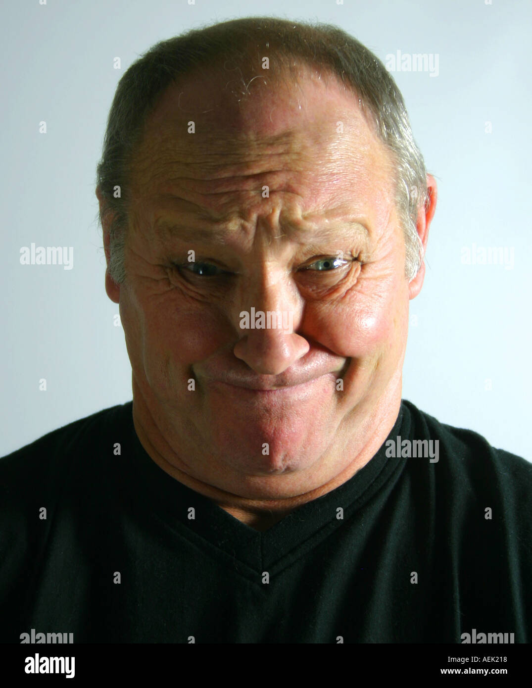 Man aged sixty with face which is about to explode Stock Photo - Alamy