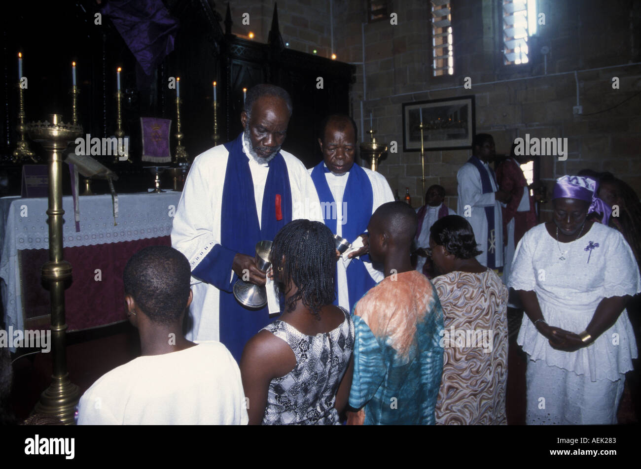 CHRISTIANITY priests distributing the holy sacraments during Communion ...
