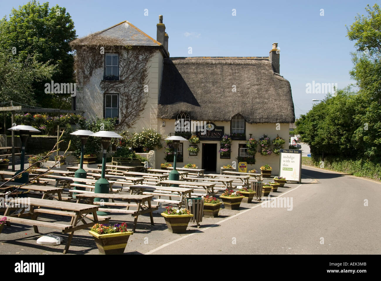 Mullion The Old Inn showing gas heaters amongst Cornish outdoor bar ...