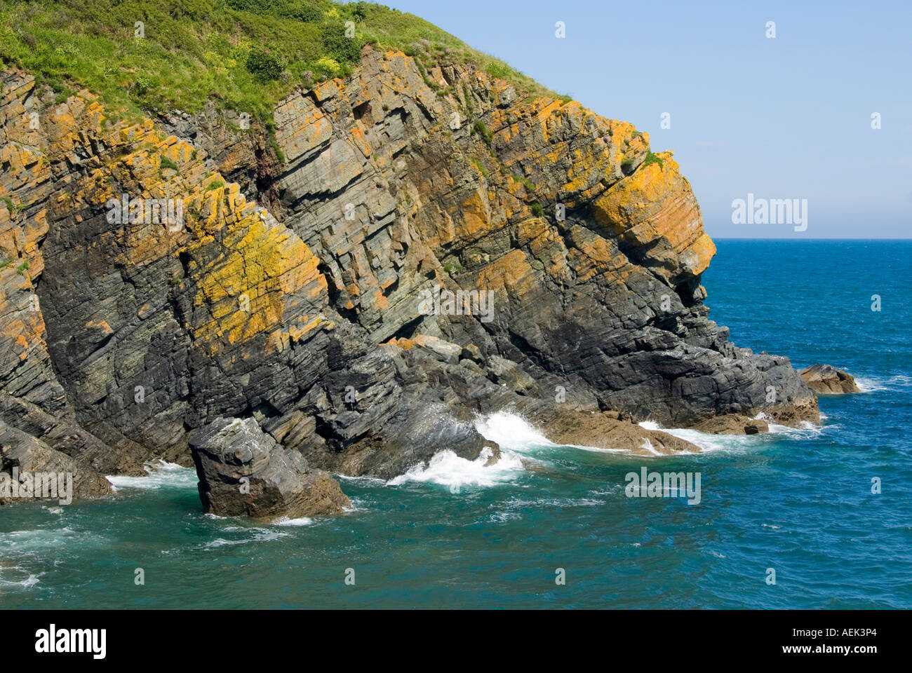 Sloping strata lines on geological rock formation at narrow unprotected ...