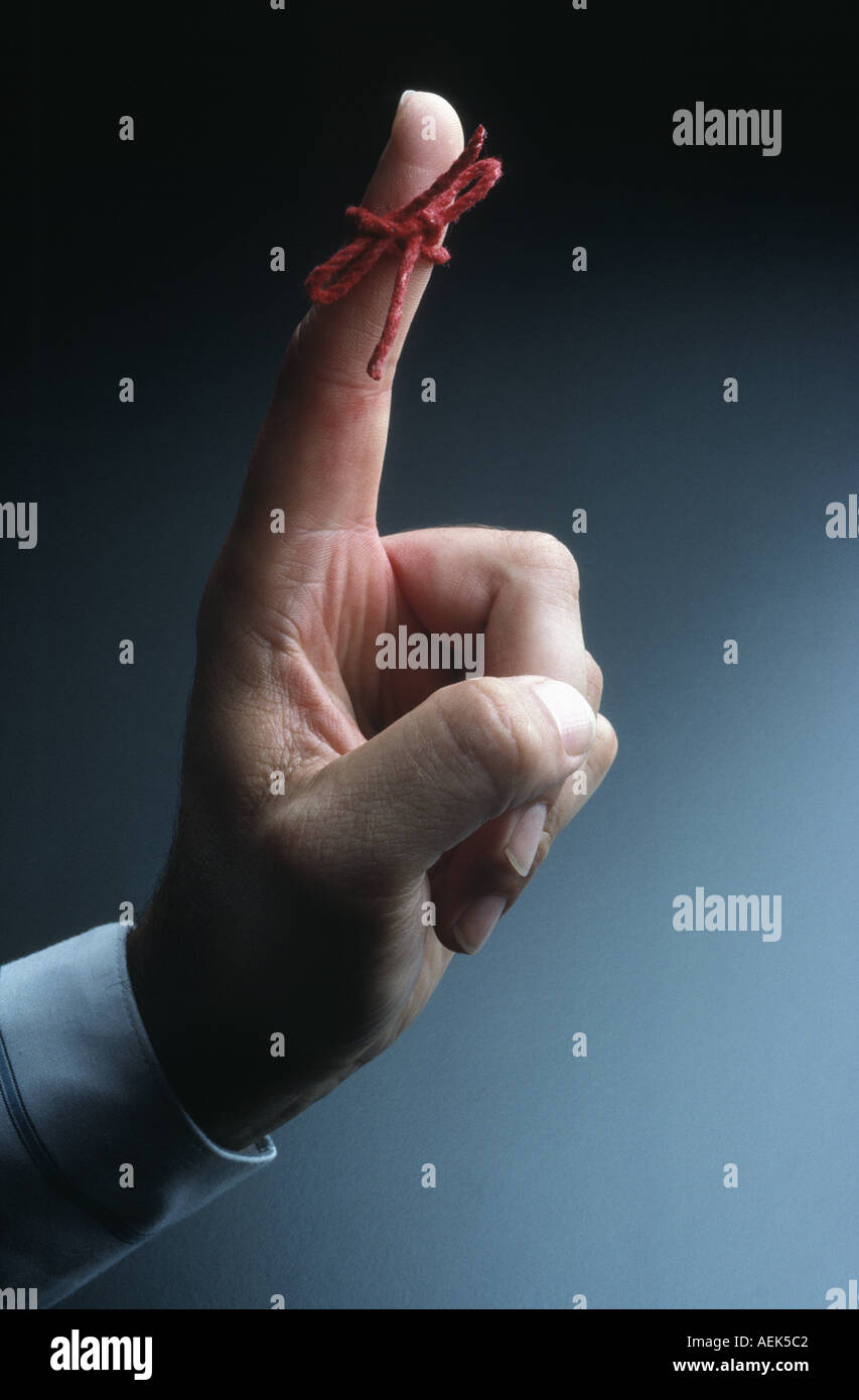 String tied around finger Stock Photo - Alamy