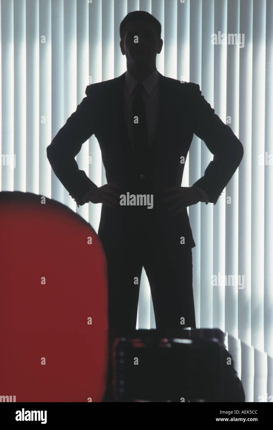 Silhouette of male executive looking out office window Stock Photo - Alamy