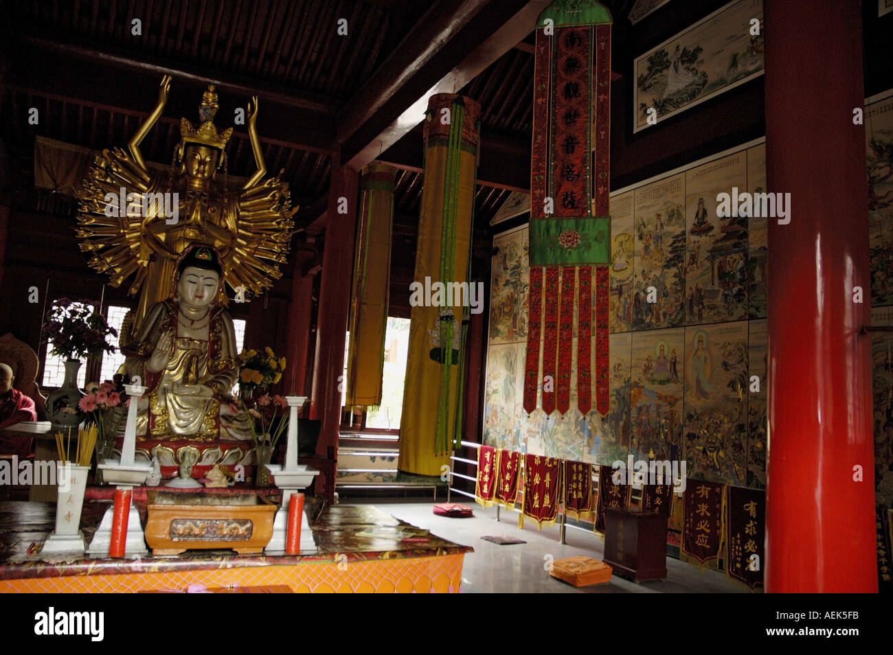 Golden Buddhist statues in the beautifully decorated interior of Wo ...