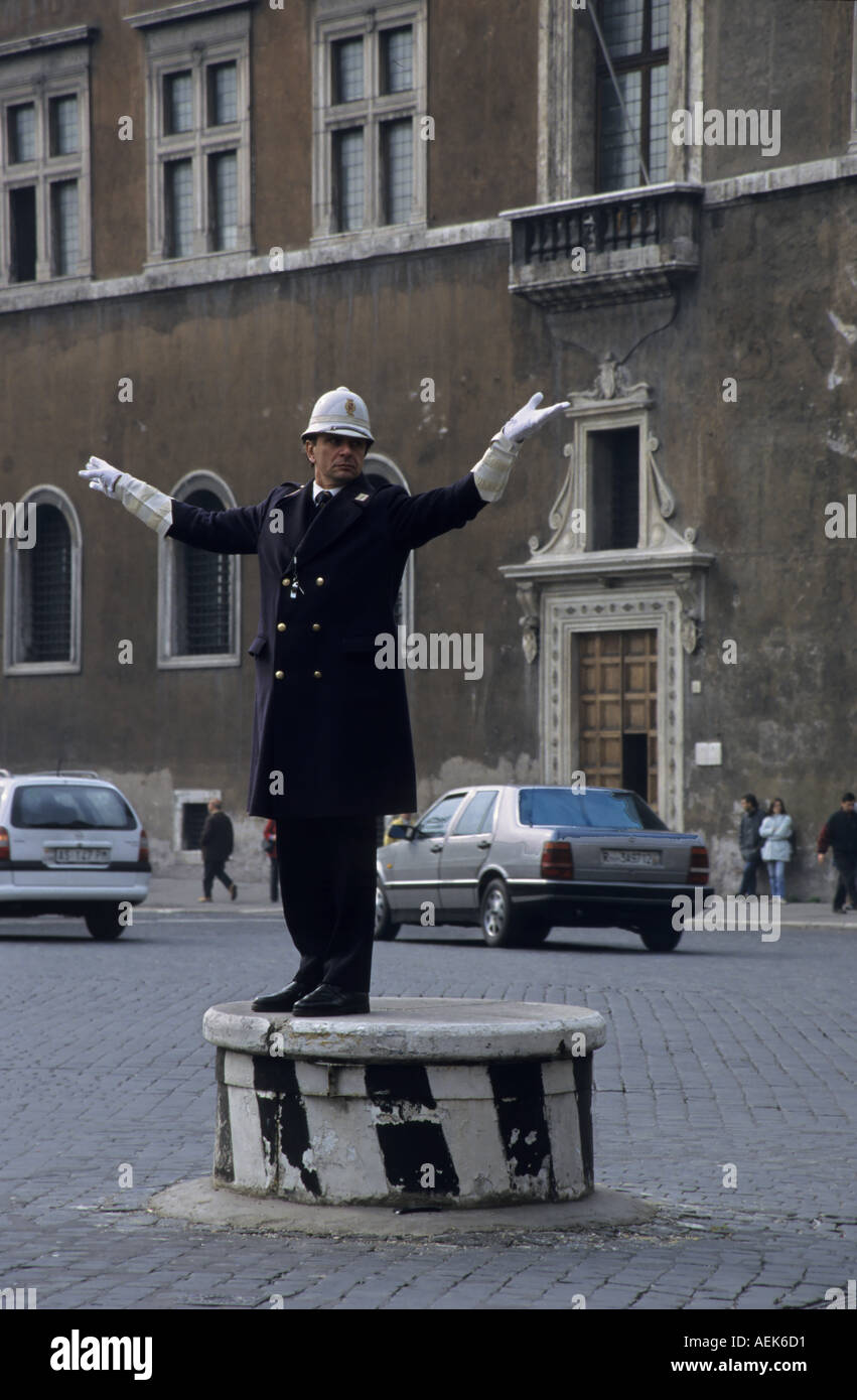 Police officer directing traffic in the Piazza Venezia, Rome, Italy ...