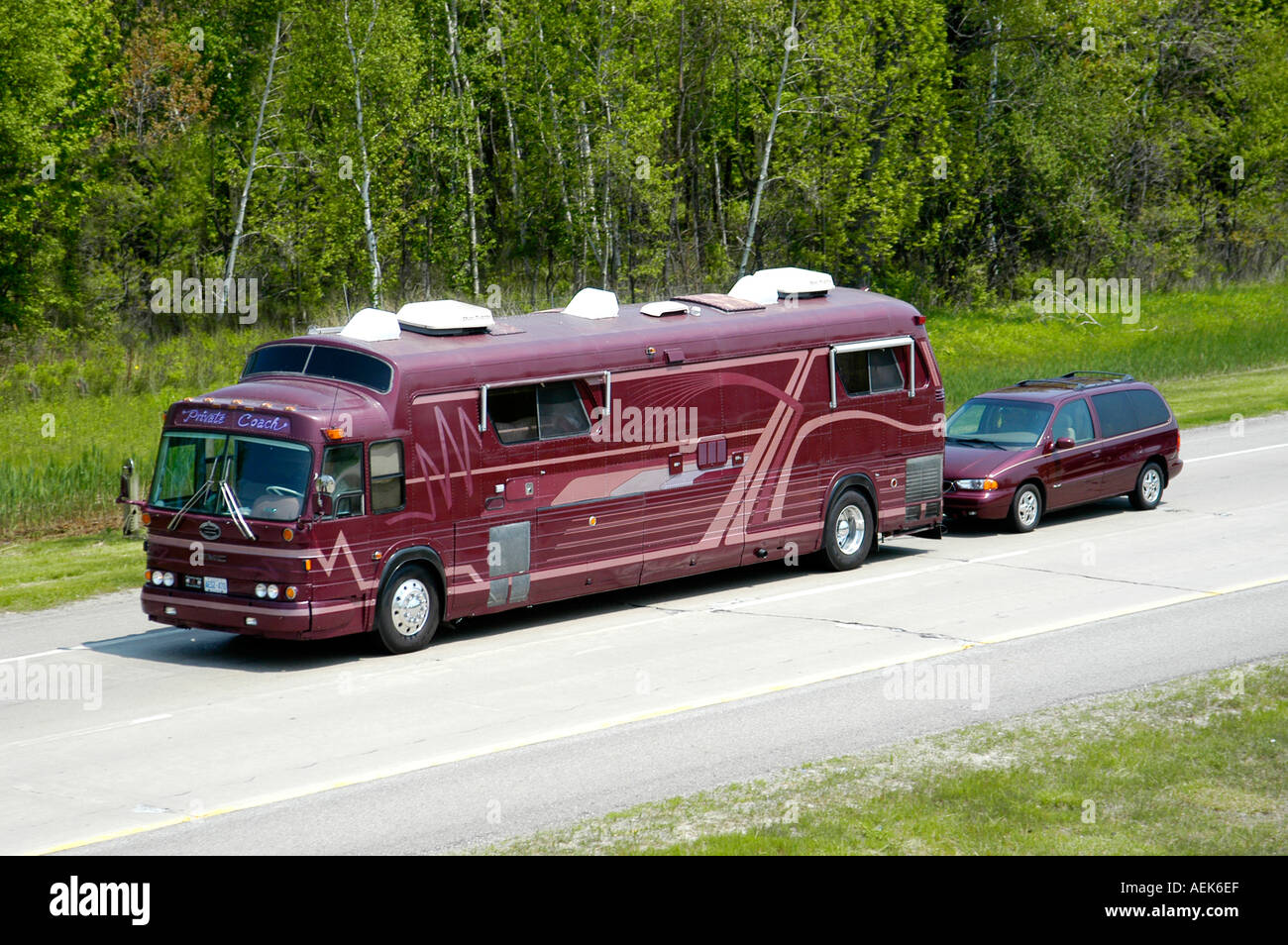 Motor home coach tows car while traveling on interstate I 69 highway ...