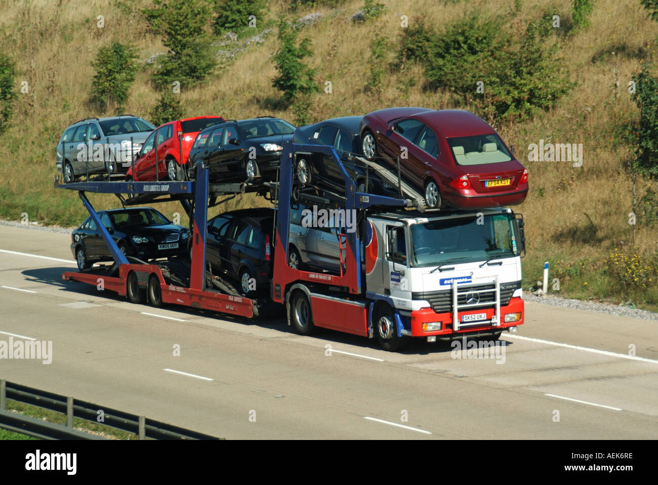 M25 motorway new vehicles on delivery transporter lorry Stock Photo - Alamy
