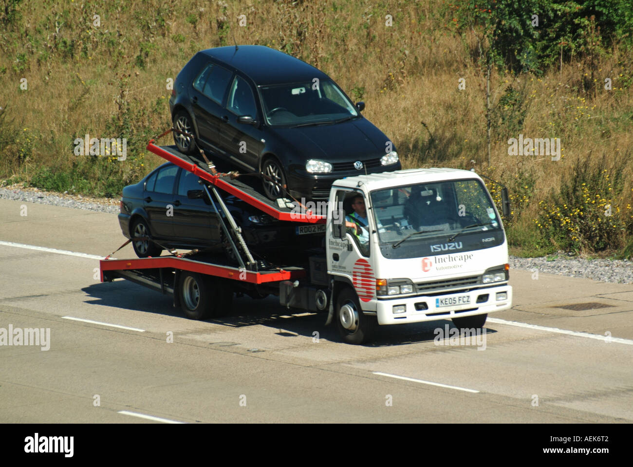 M25 motorway loaded car delivery transporter lorry Stock Photo - Alamy