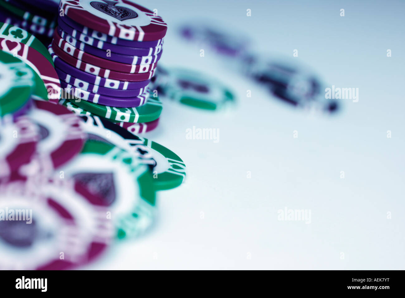 Gaming chips on white surface Stock Photo - Alamy