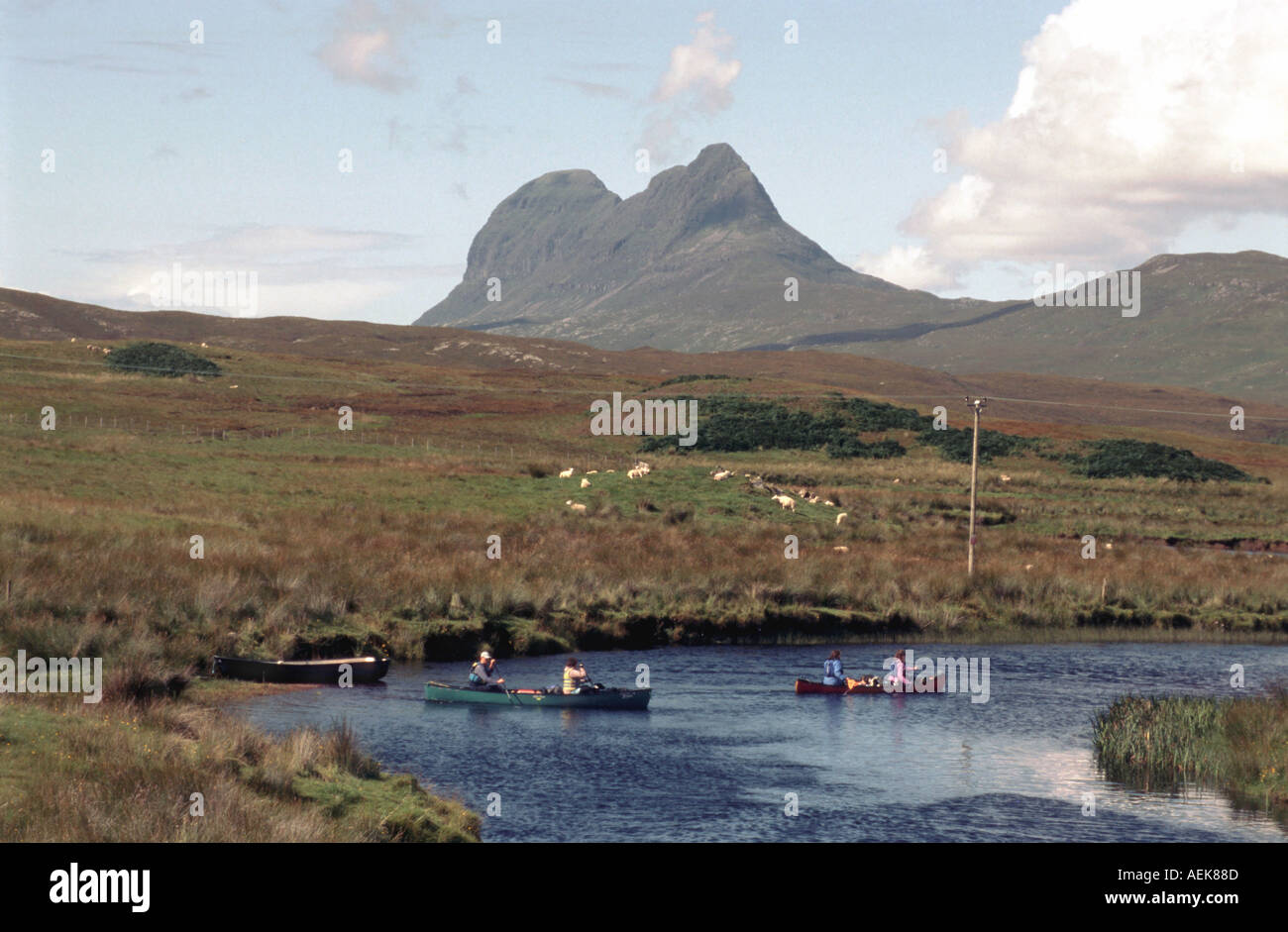 Mount Suilven and canoes Scotland UK Stock Photo - Alamy