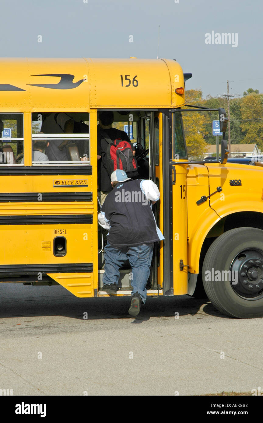 School busses in line to pick up students at the end of the school day ...