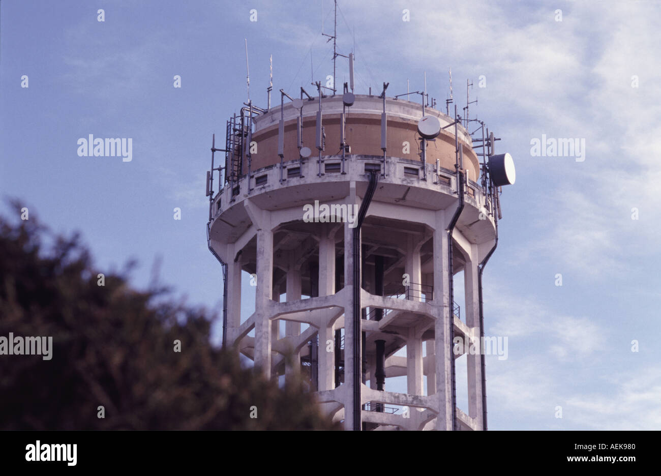 Mobile phone transmitters fitted to a water tower Stock Photo - Alamy