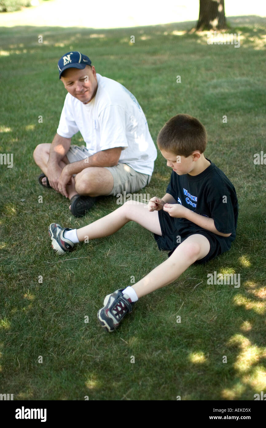 Young Boy Widdling with Pocket Knife Stock Photo - Alamy