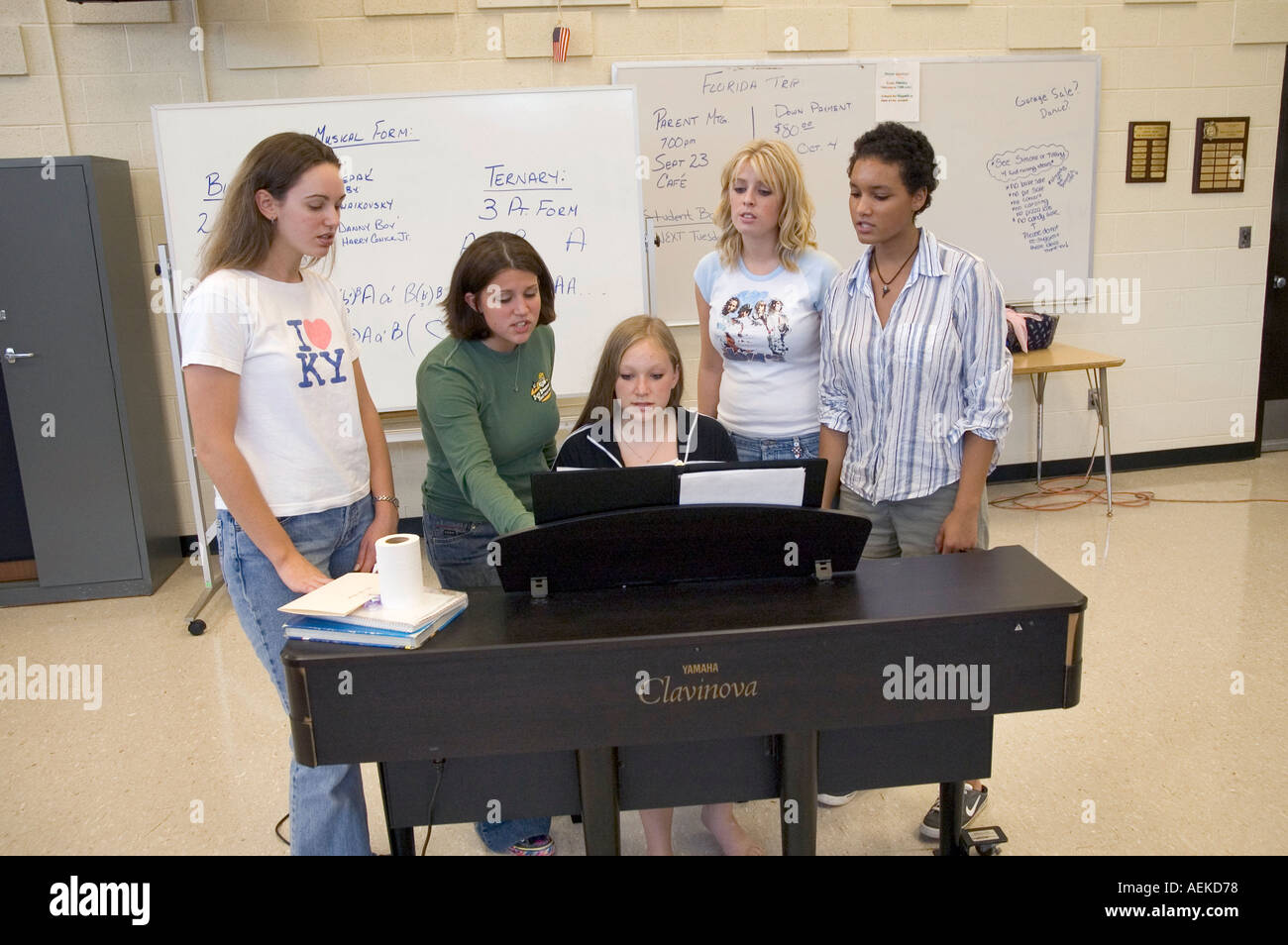 High school students practice musical routine using piano in choir ...