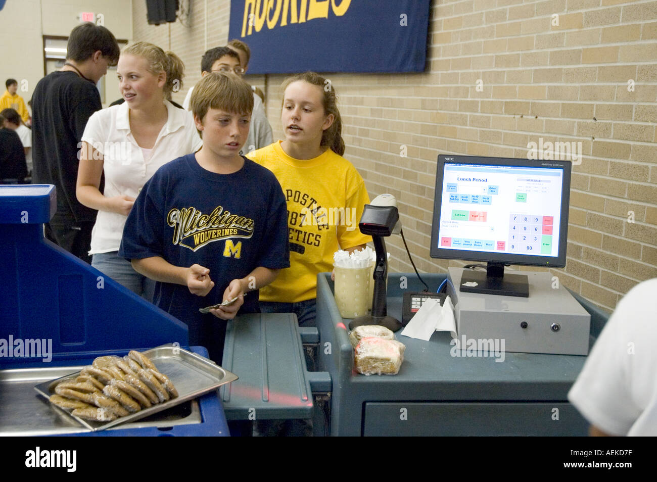 High school students buy and eat lunch in a cafeteria lunchroom Stock ...