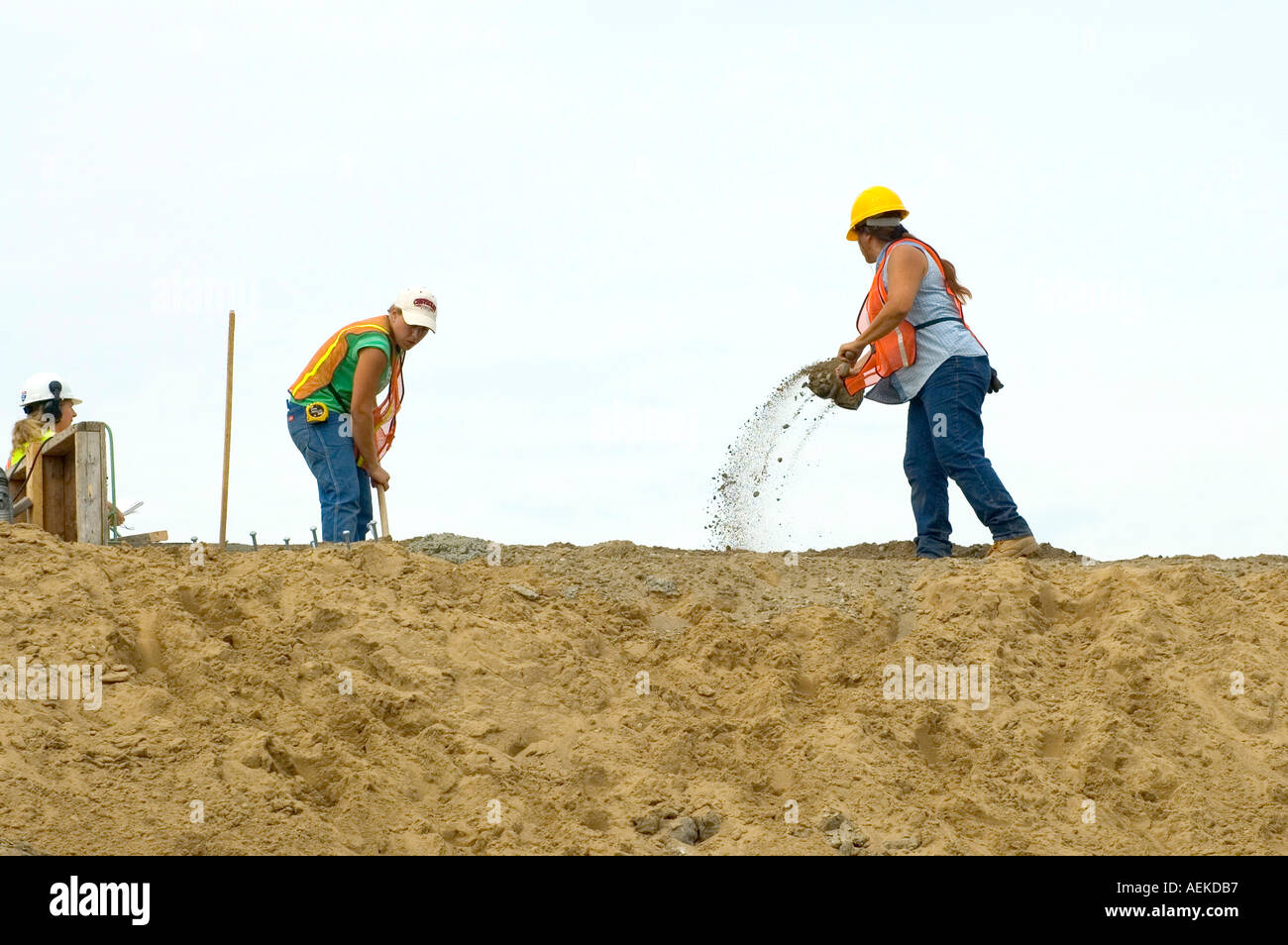 Female Road Construction workers build a bridge over highway Interstate ...