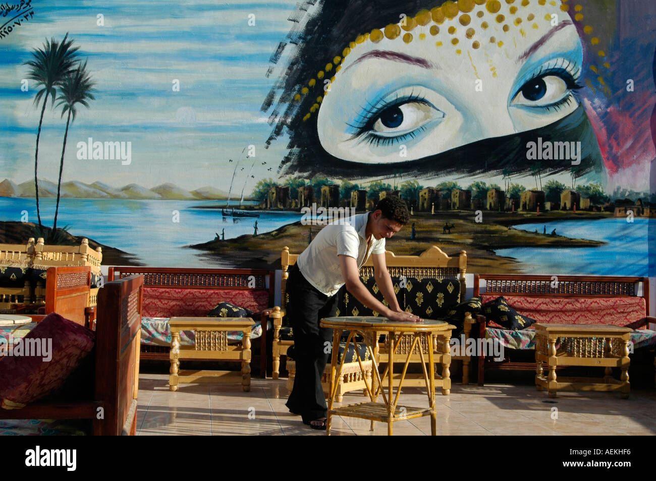 An Egyptian waiter setting up a table in a restaurant in Sharm el ...