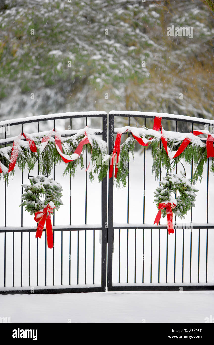 Gate with Christmas wreaths and decorations Stock Photo - Alamy