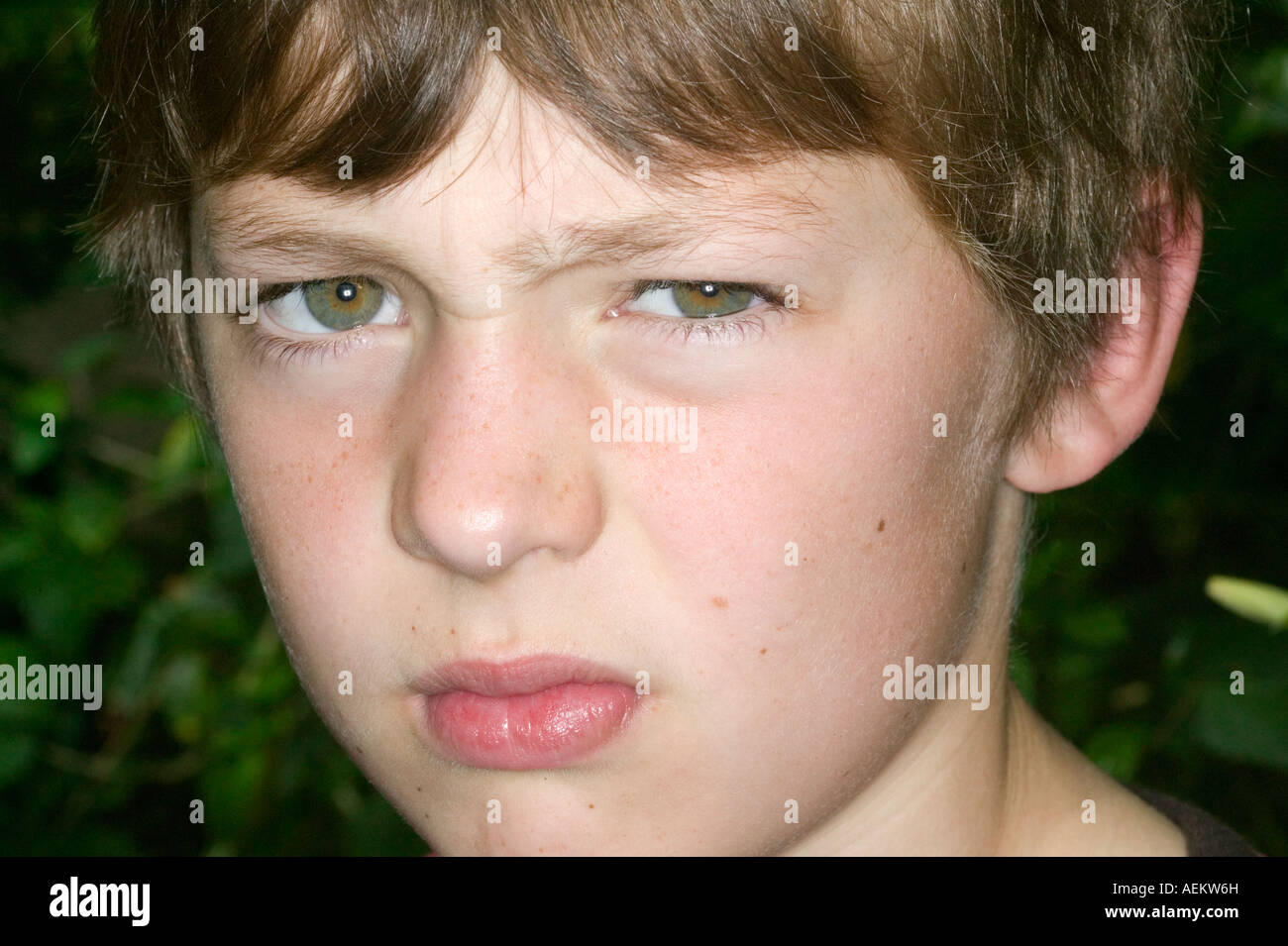 angry looking young boy Stock Photo - Alamy