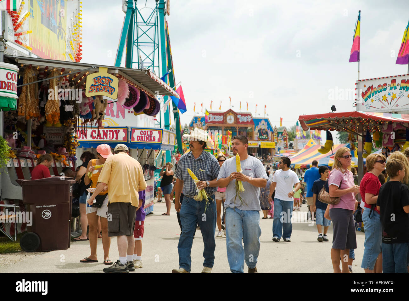 ILLINOIS Grayslake Two men carry roasted ears of sweet corn at Lake ...