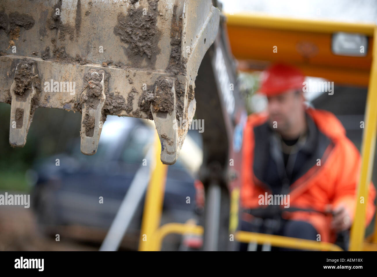 DIGGER DRIVER ON A BRITISH BUILDING SITE Stock Photo - Alamy