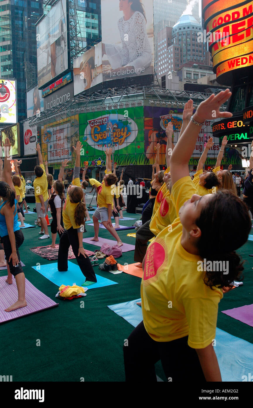 Yoga practitioners in Times Square observe the Summer Solstice Stock ...