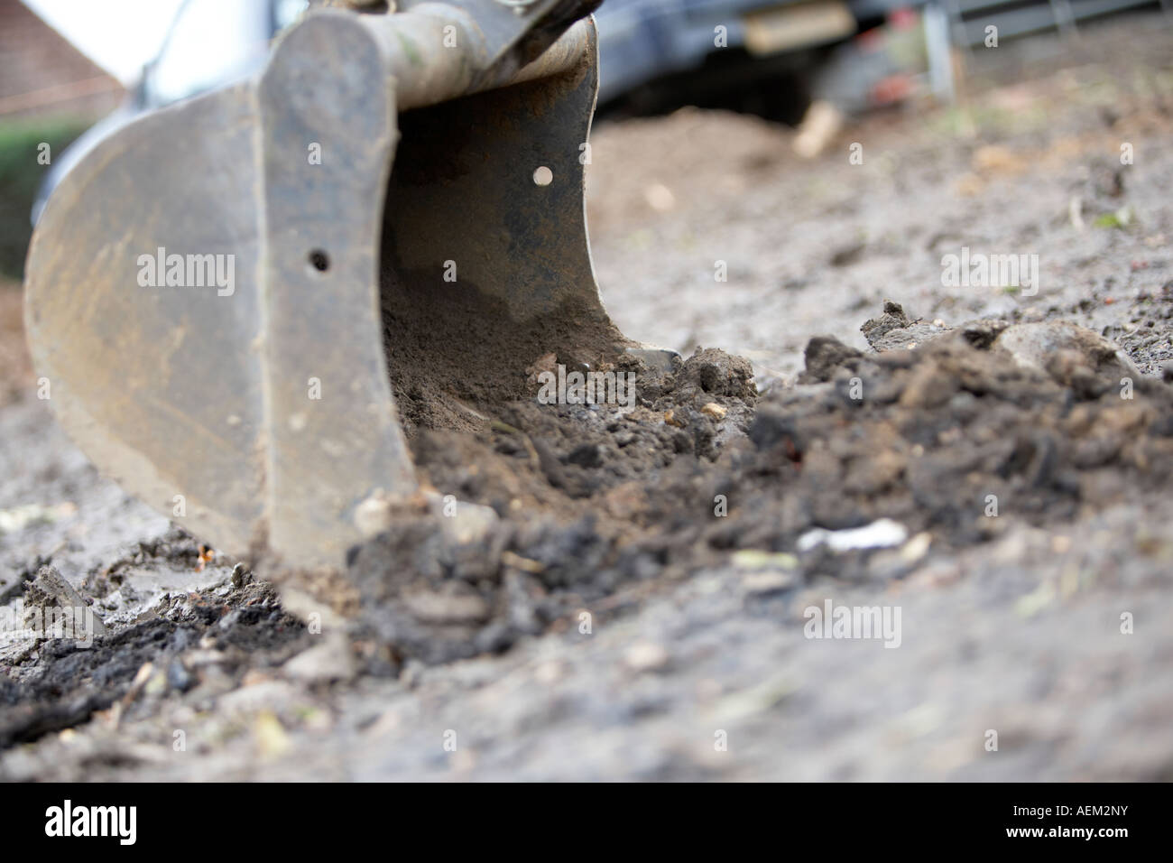 BREAKING GROUND WITH A DIGGER ON A CONSTRUCTION SITE Stock Photo - Alamy