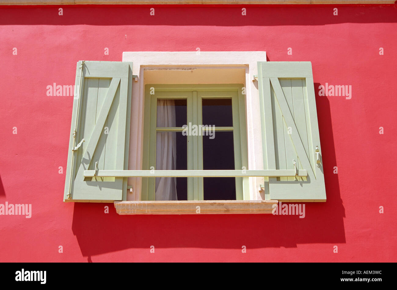 Green and cream window and pink wall of house, Stil Tipaldou, Lixouri ...