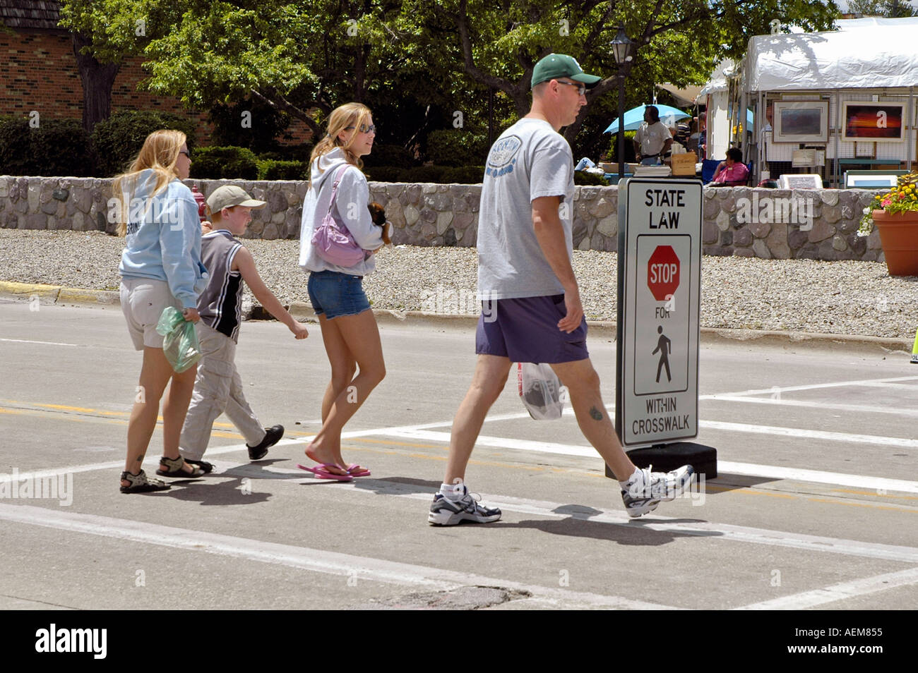 Sign in street stopping traffic safely allows pedestrians to cross ...
