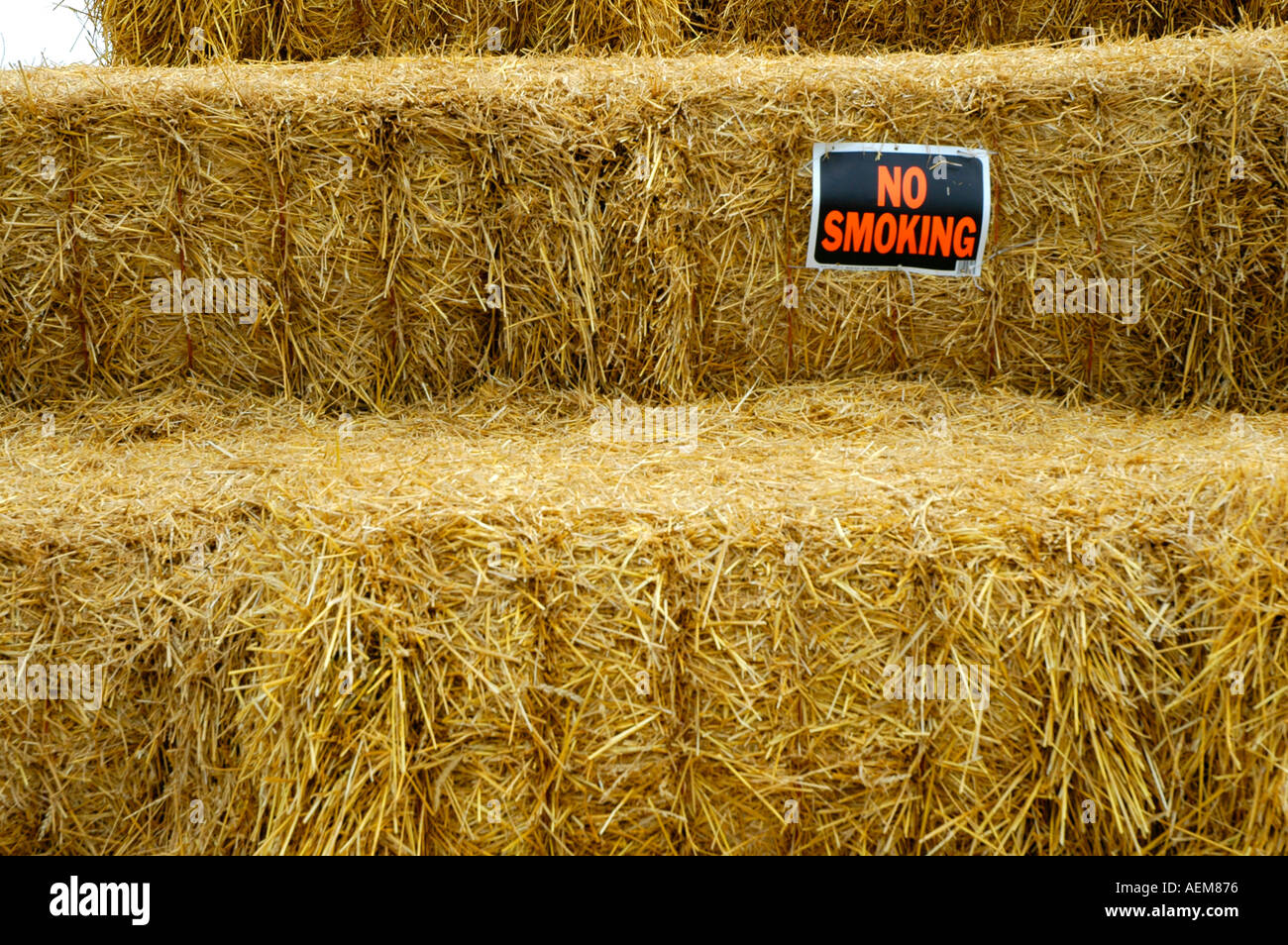 No smoking signs placed on bails of hay Stock Photo - Alamy