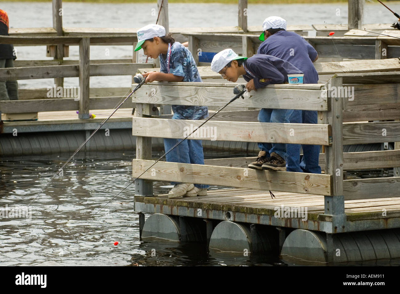 Parents take young children fishing as part of Childs event Stock Photo ...