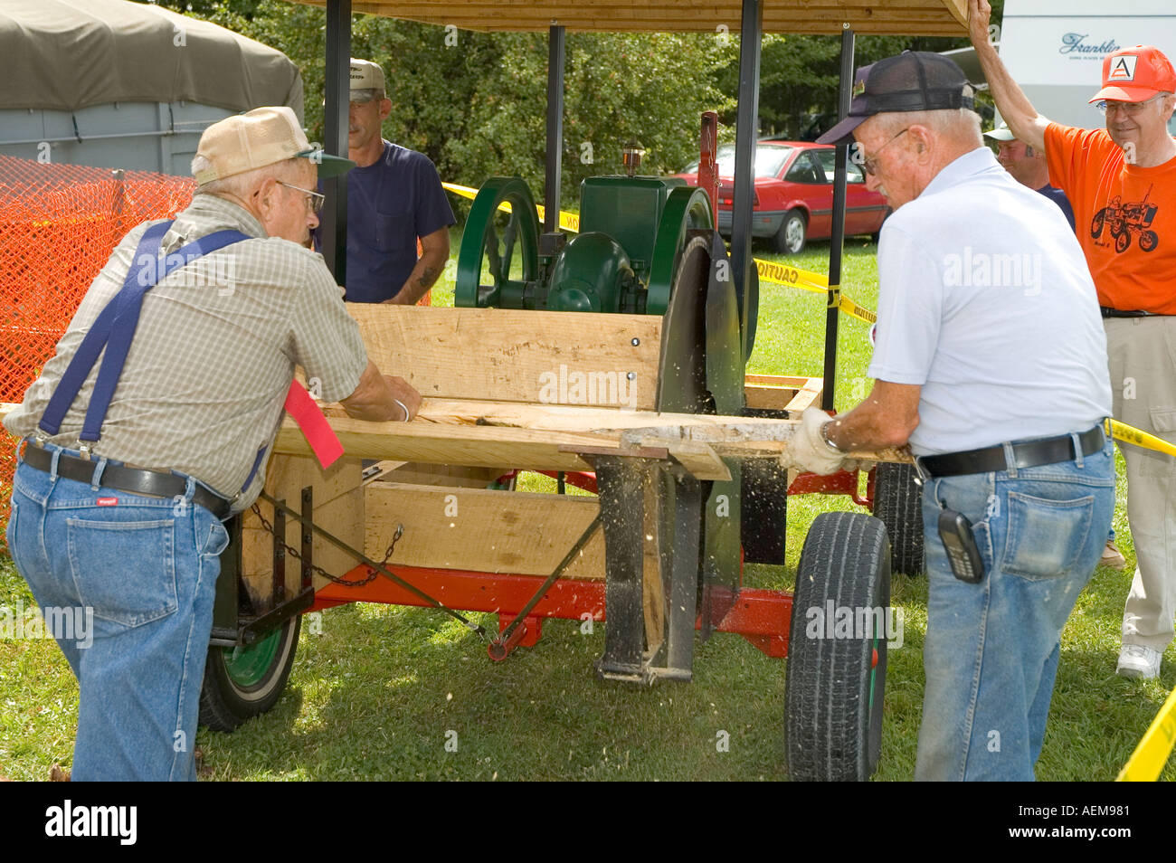Local farmers demonstrate saw milling techniques in a circa 1920 saw ...