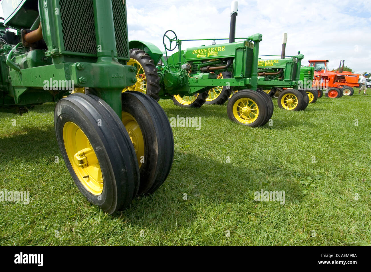 Local farmers display old farm tractors in a circa 1920 saw mill ...